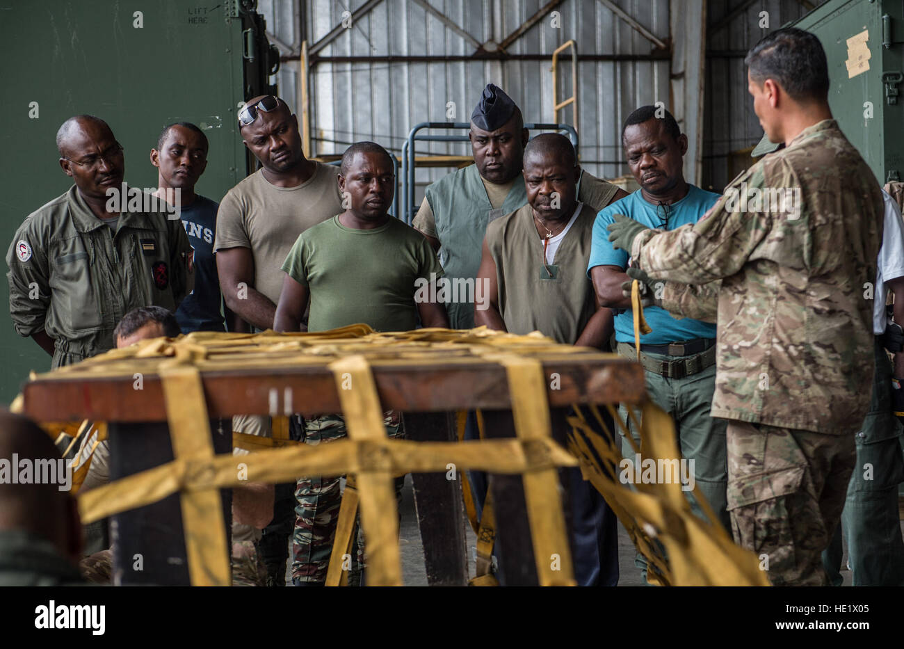 Master Sgt. Alex Chavez shows students how to secure a cargo net during ...