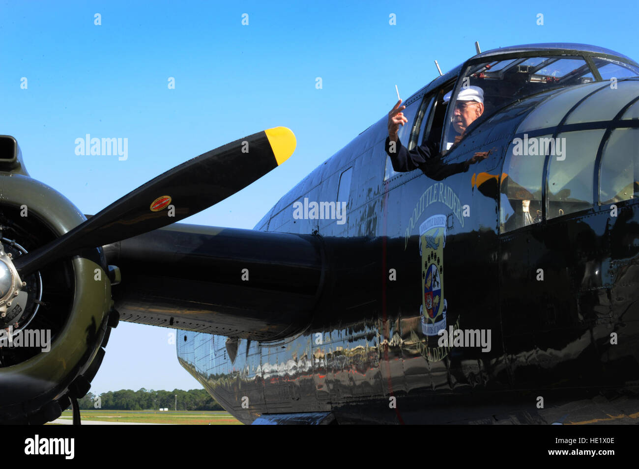 Ret. Lt. Col. Dick Cole, Doolittle Raider co-pilot crew 1, signals the ...
