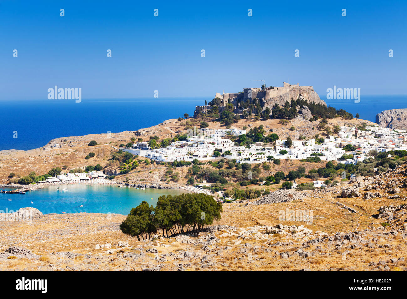 Panoramic view of Lindos town, bay and Acropolis Stock Photo - Alamy