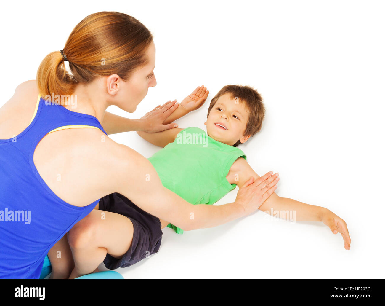 Happy kid boy exercising with his mother Stock Photo - Alamy