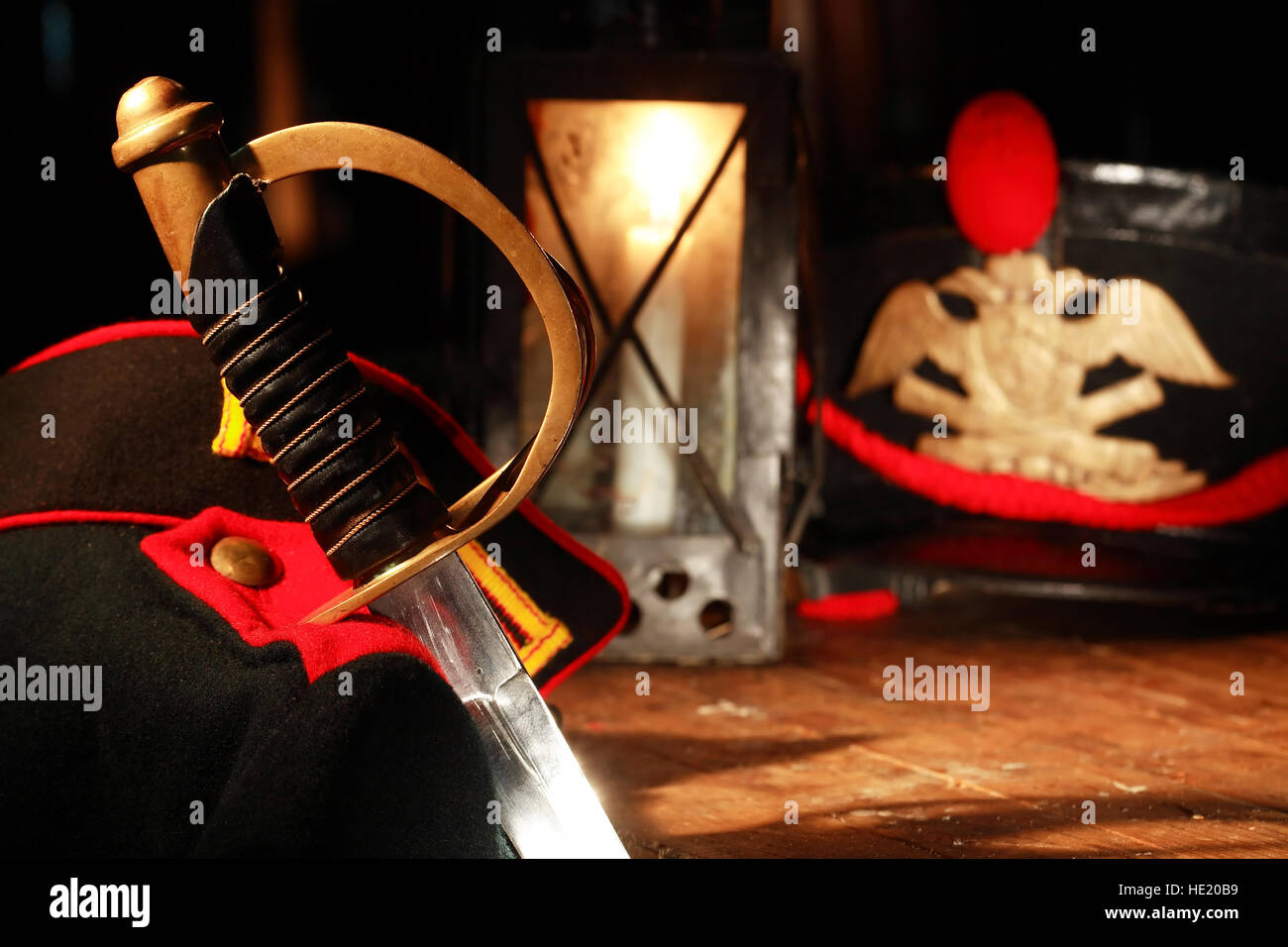 Vintage still life with ancient sword near uniform on background with ...