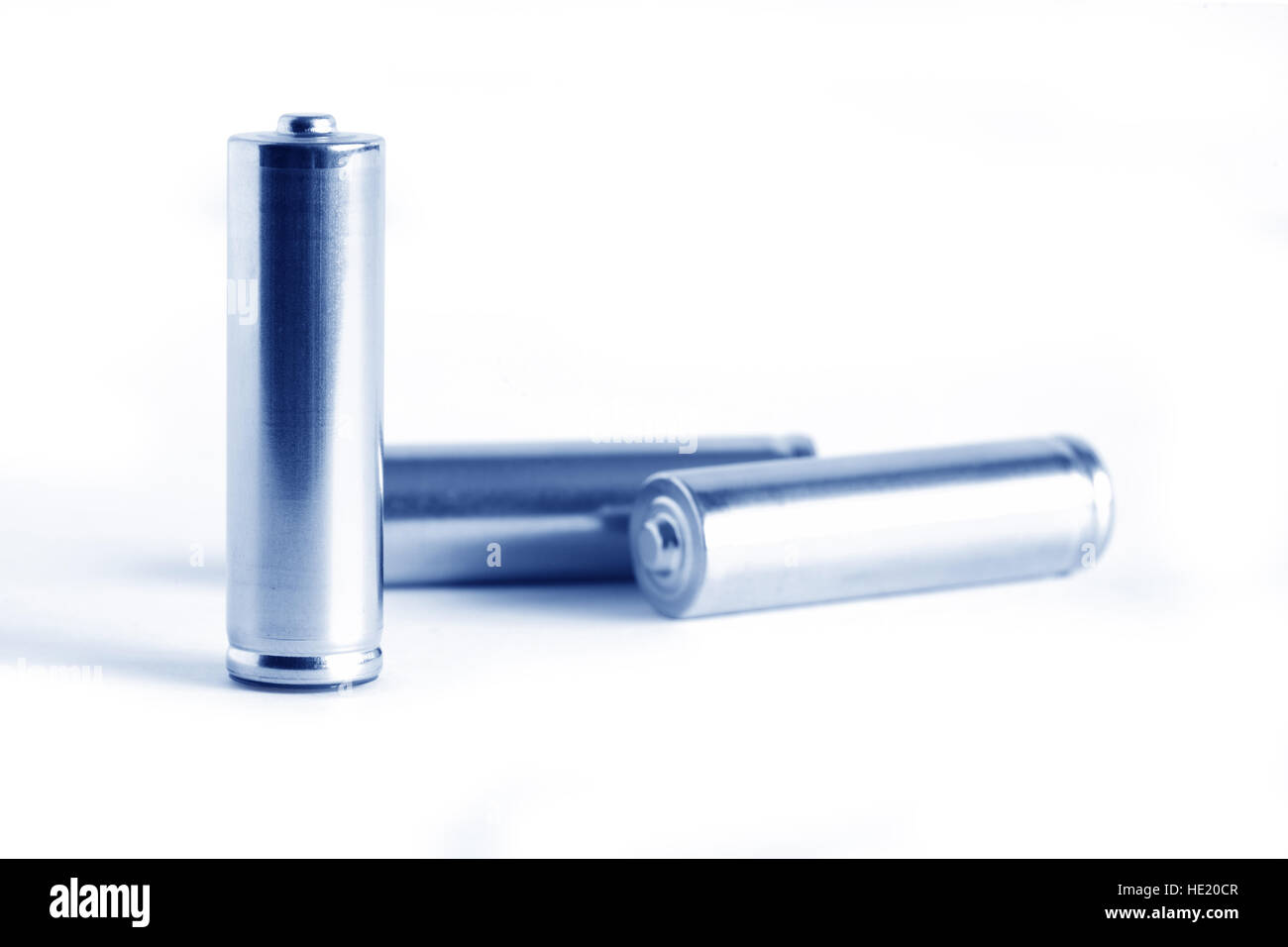 Few ordinary batteries on white background Stock Photo - Alamy