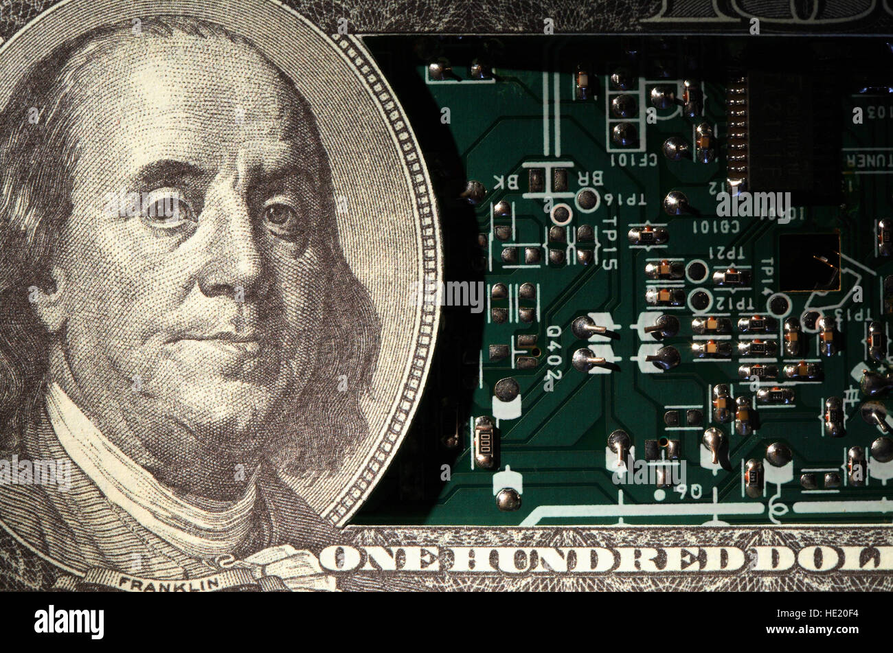 Closeup of one hundred dollar note with green computer mainboard Stock ...