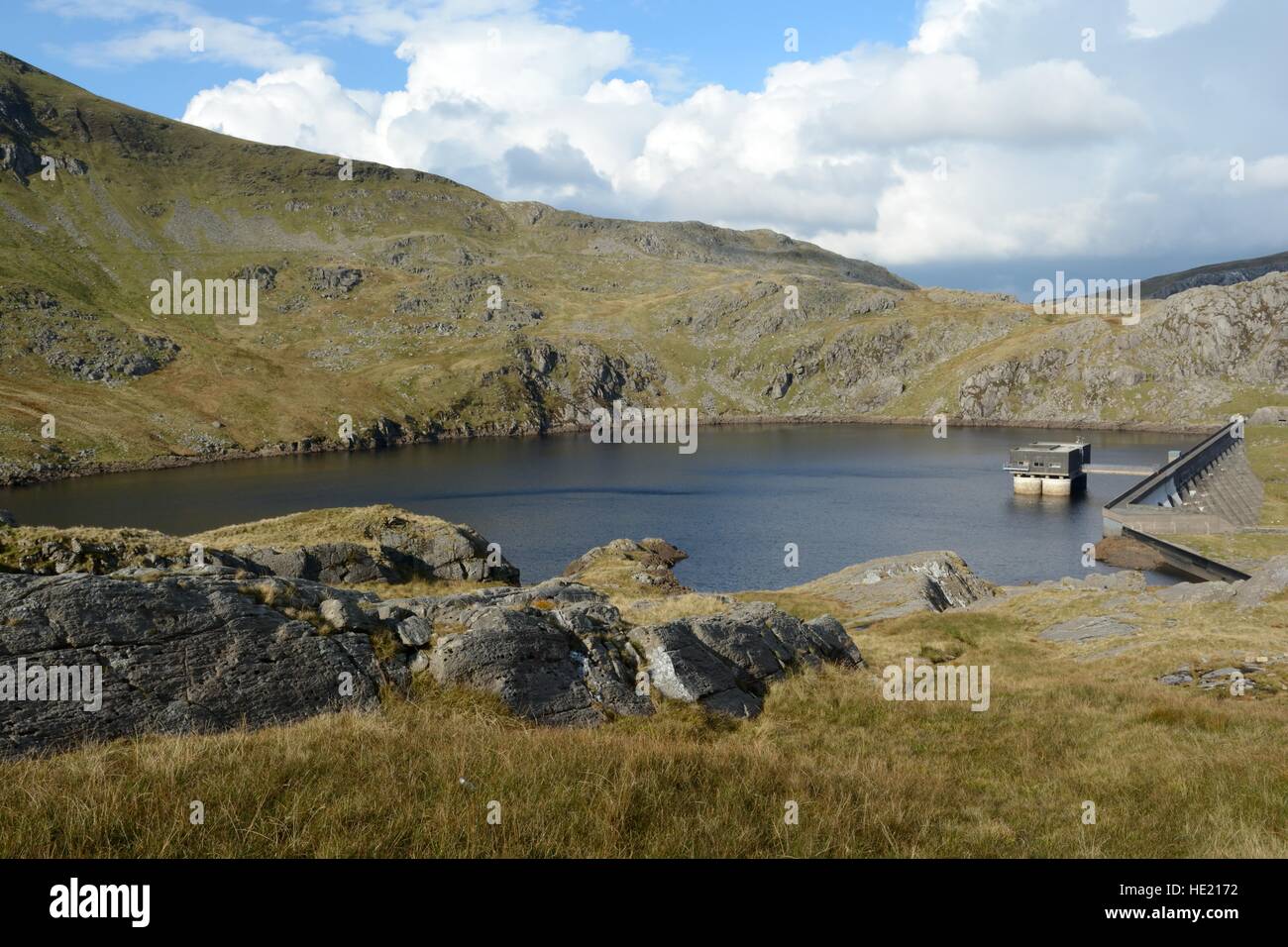 Stwlan Dam reservoir above Tanygrisiau Moelwyn mountain range Snowdonia ...
