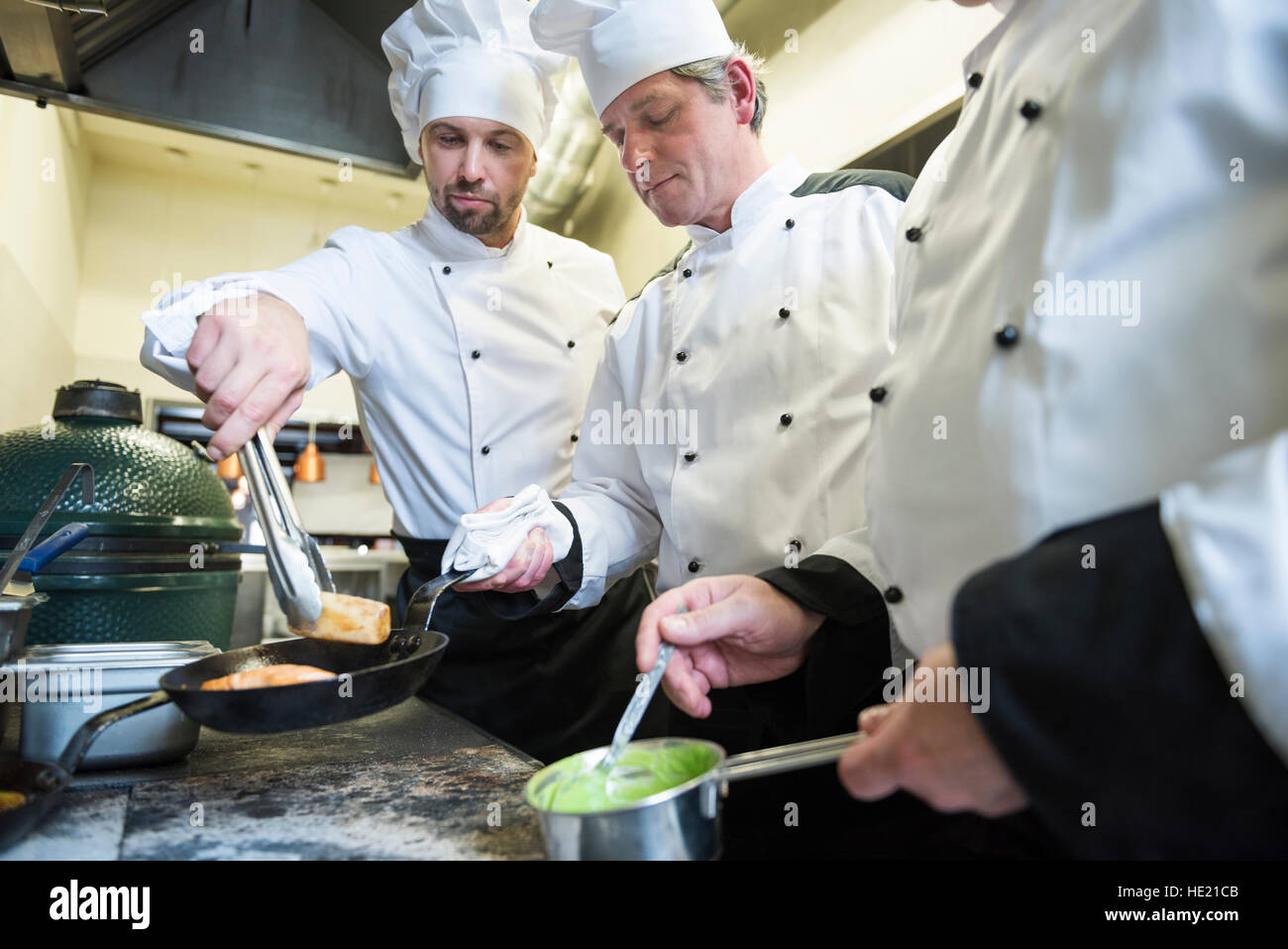 Teamwork is very important in the kitchen Stock Photo - Alamy
