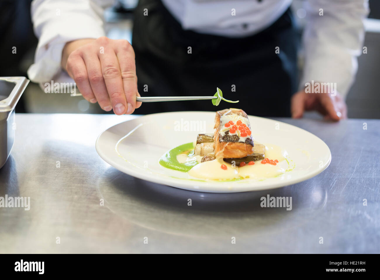Professional chef cooking fish hi-res stock photography and images - Alamy