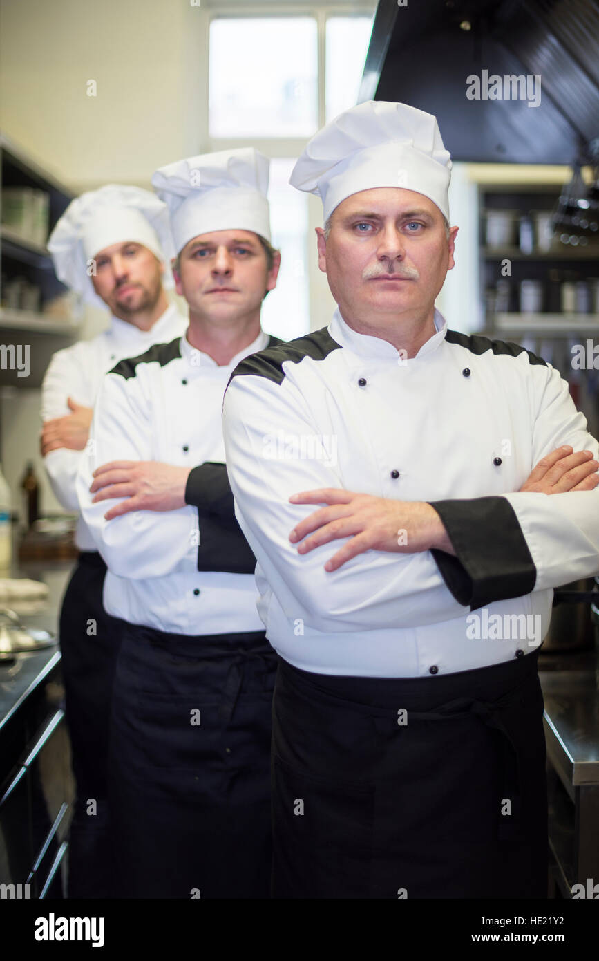 Chefs in the kitchen interior Stock Photo - Alamy