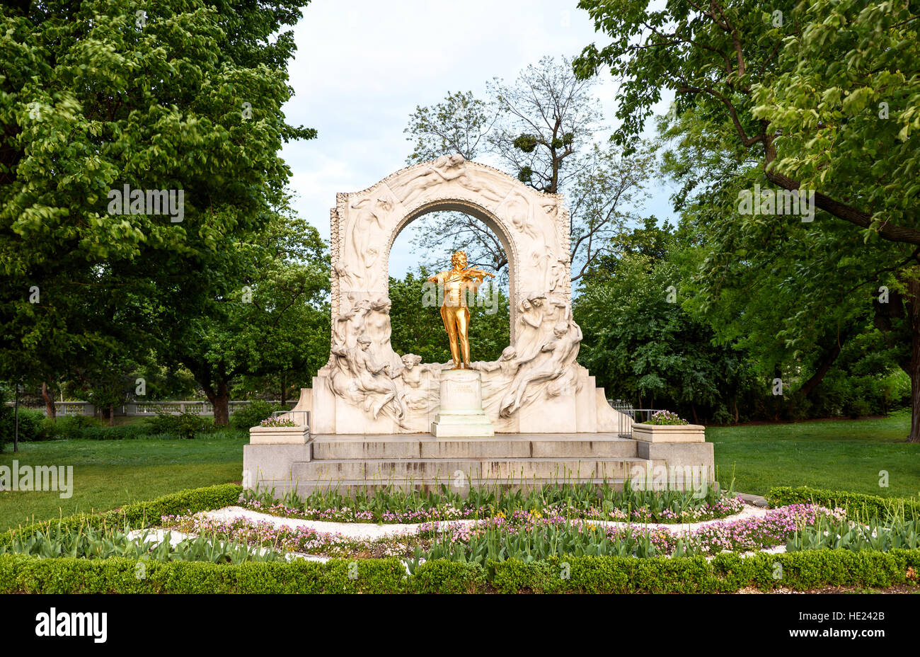 Photo of golden johann strauss statue at stadpark at sunset in vienna ...