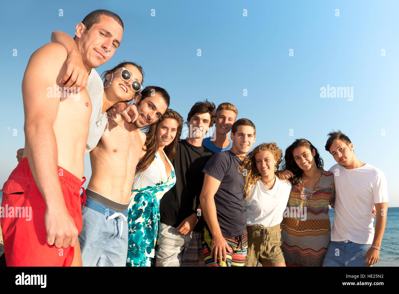 Group of happy teenage friends at the beach Stock Photo - Alamy