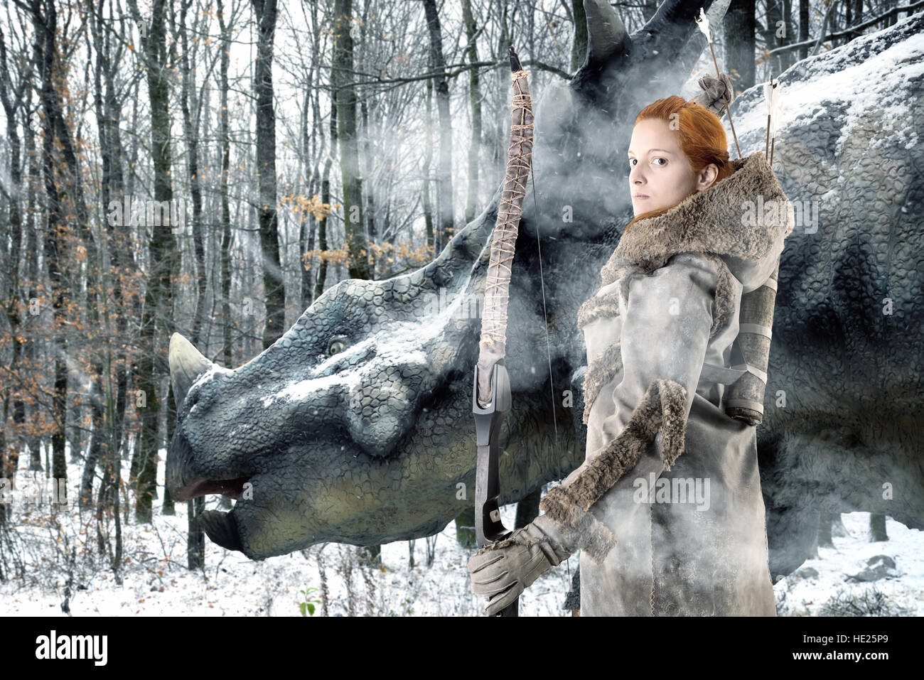 Wild girl archer in a forest with bow and triceratops Stock Photo - Alamy