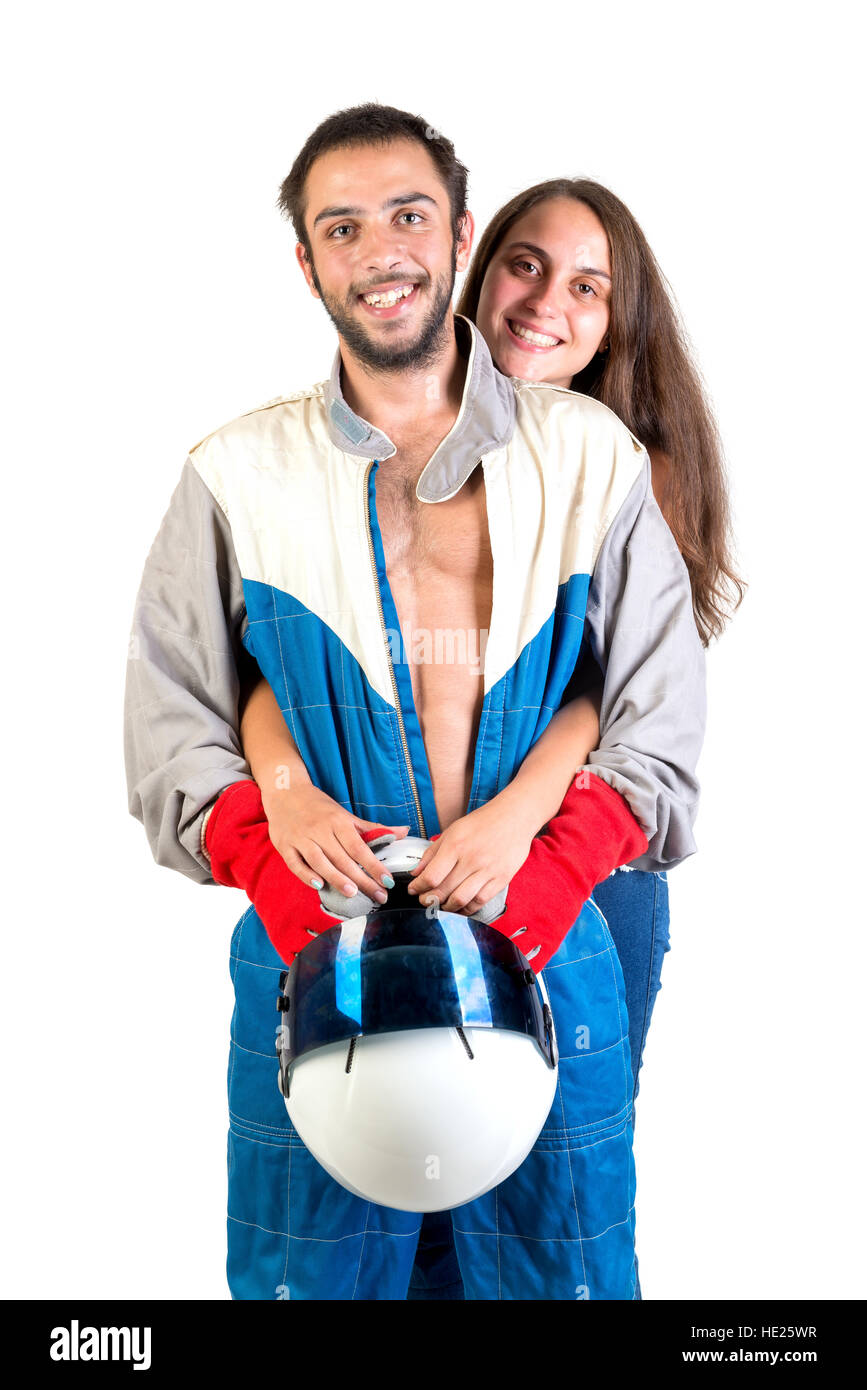 Racing driver posing with girl isolated in white Stock Photo - Alamy