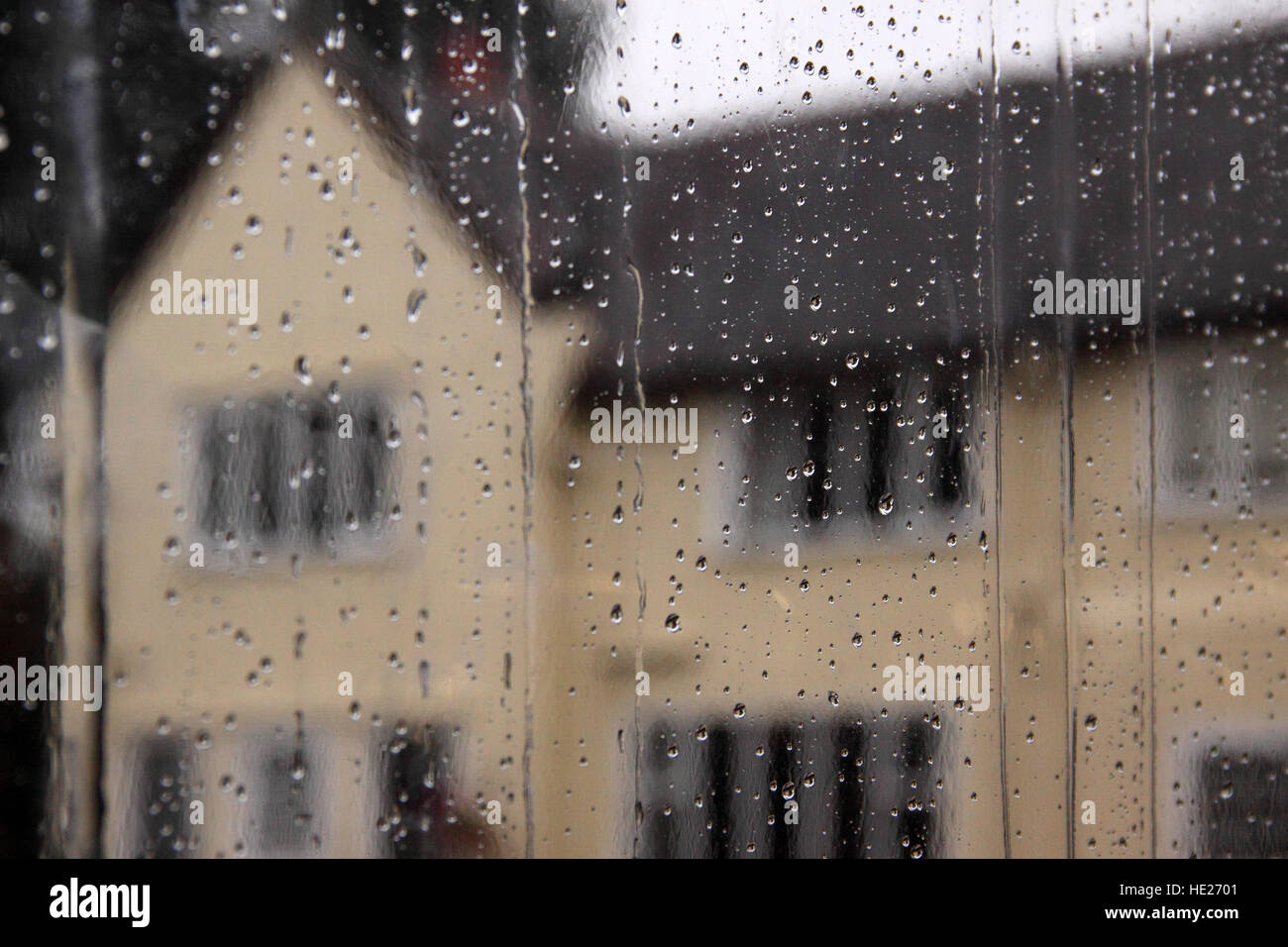 A house viewed through rain on a window Stock Photo - Alamy