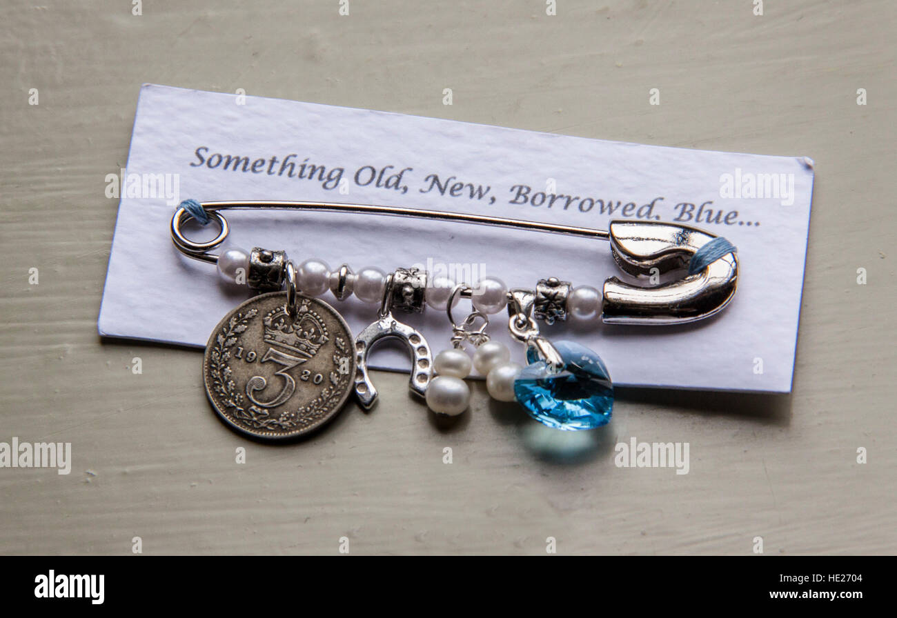 Something old, new, borrowed, blue, safety pin with coin, gemstone ...