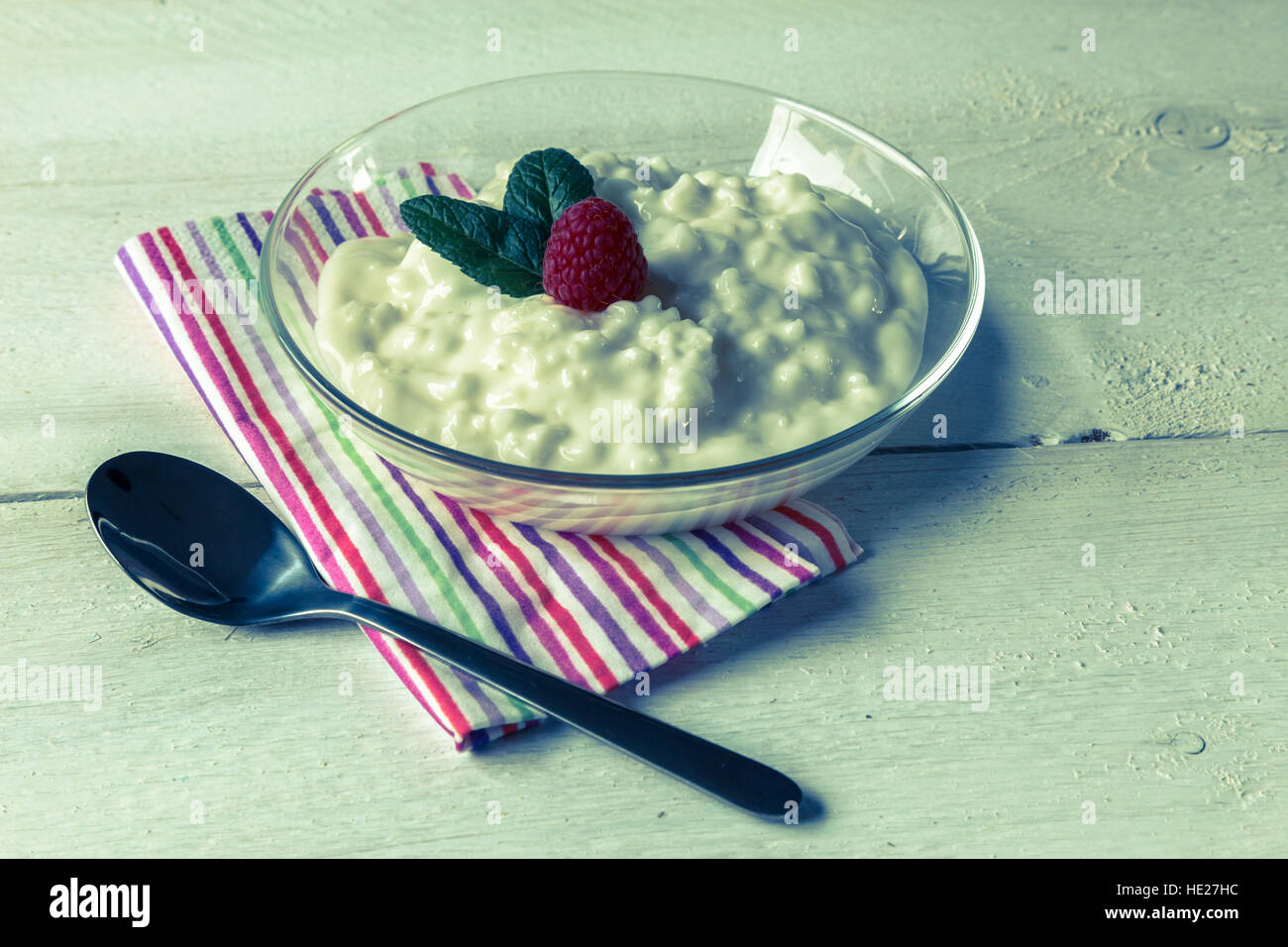 Rice pudding with mint and raspberry Stock Photo - Alamy