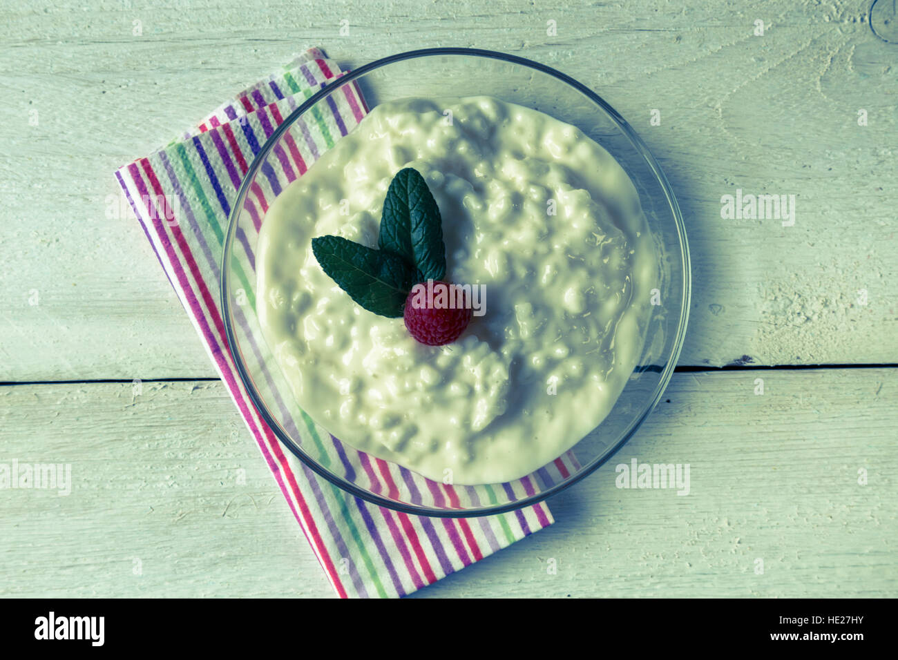 Rice pudding with mint and raspberry Stock Photo - Alamy