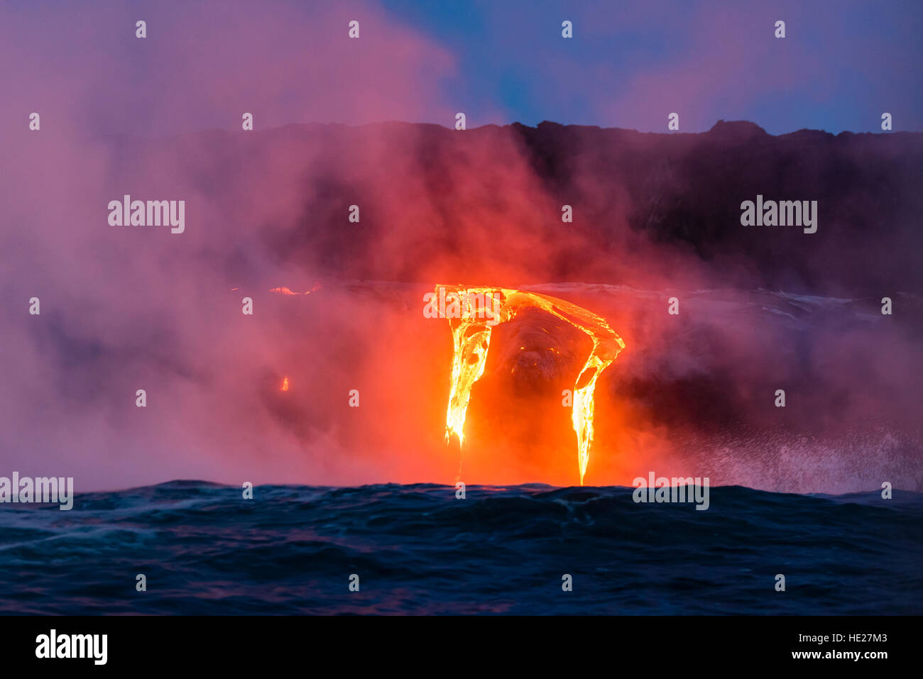 Lava flow entering the ocean at dawn, Hawaii Volcanoes National Park ...