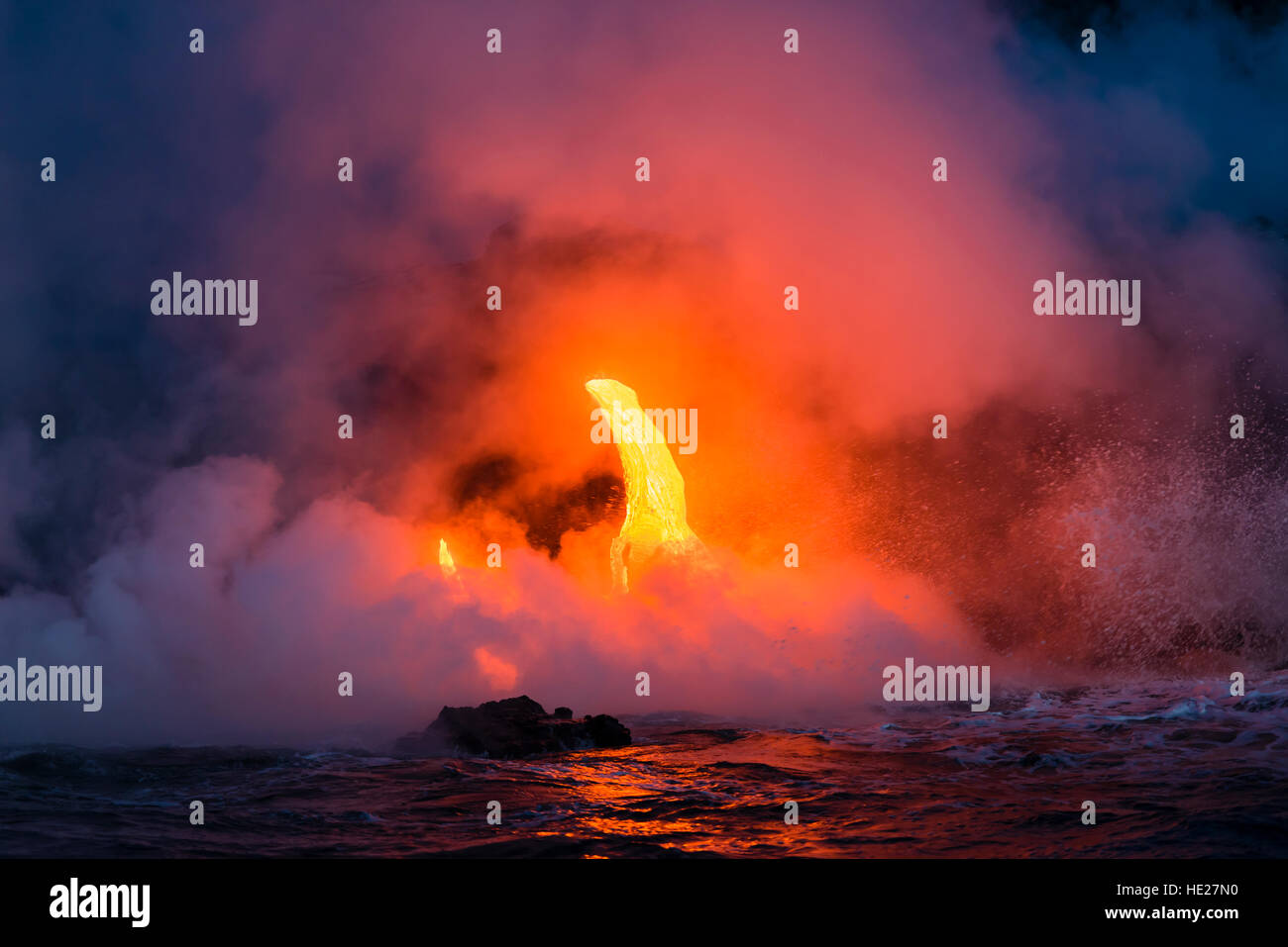 Lava flow entering the ocean at dawn, Hawaii Volcanoes National Park, The Big Island, Hawaii USA ...