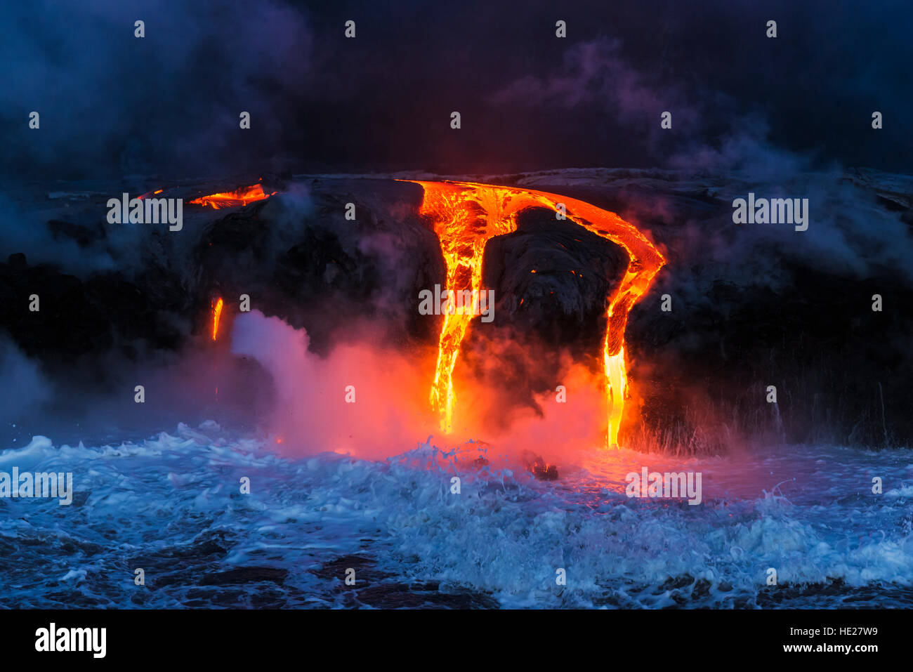 Lava flow entering the ocean at dawn, Hawaii Volcanoes National Park, The Big Island, Hawaii USA ...