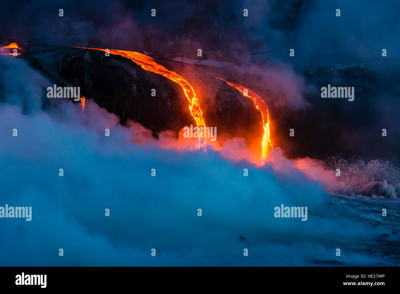 Lava flow entering the ocean at dawn, Hawaii Volcanoes National Park, The Big Island, Hawaii USA ...