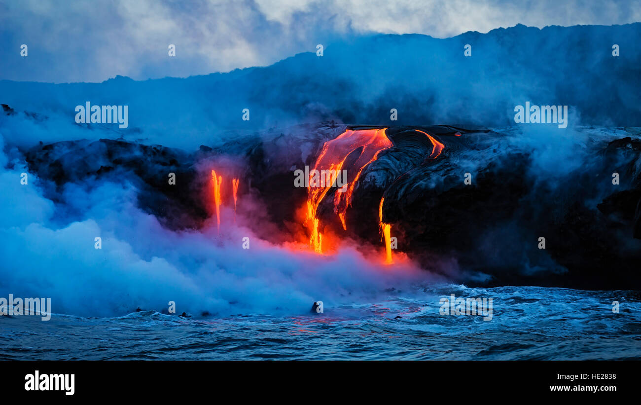 Lava flow entering the ocean at dawn, Hawaii Volcanoes National Park, The Big Island, Hawaii USA ...