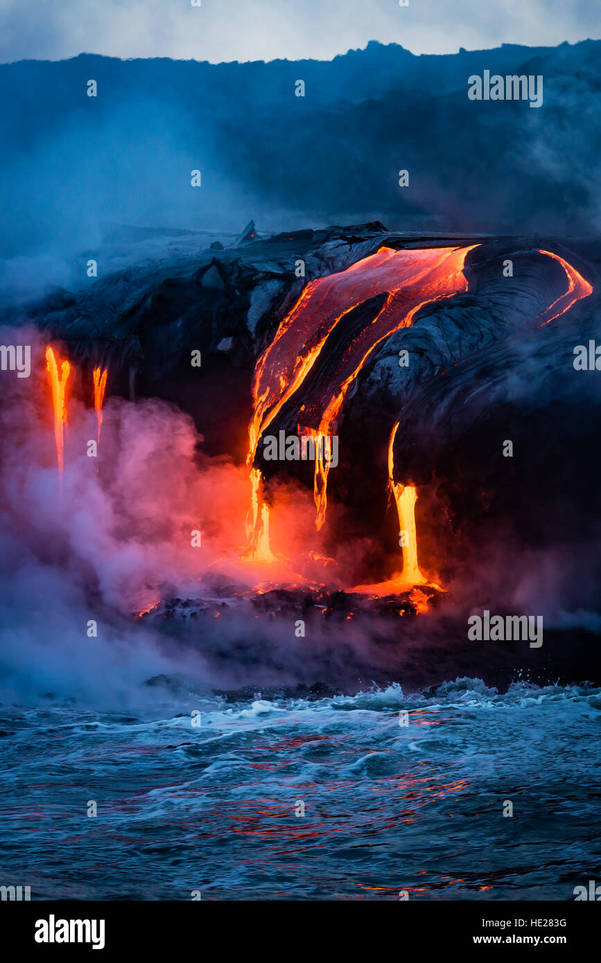 Lava flow entering the ocean at dawn, Hawaii Volcanoes National Park ...