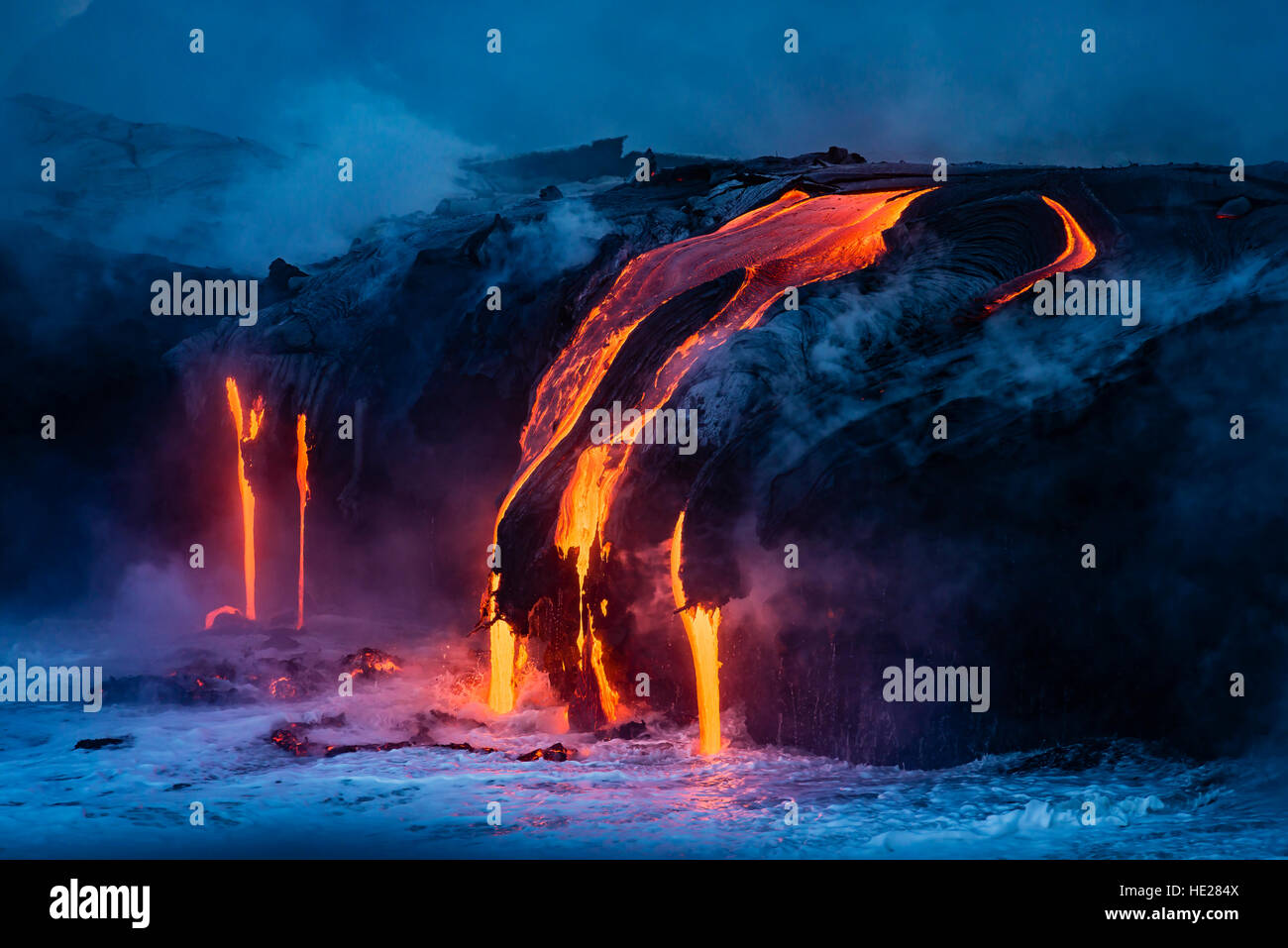 Lava flow entering the ocean at dawn, Hawaii Volcanoes National Park ...