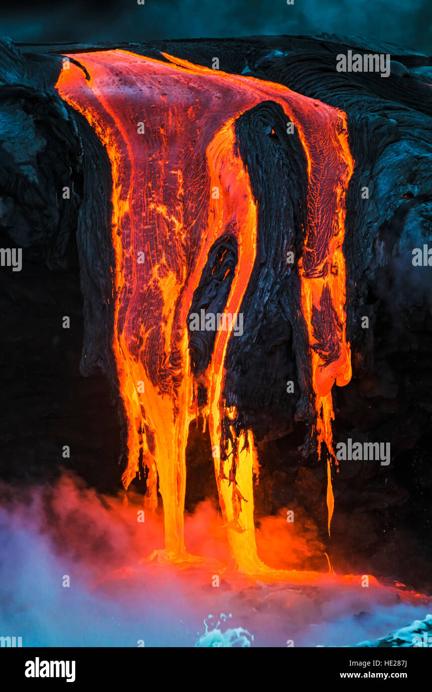 Lava flow entering the ocean at dawn, Hawaii Volcanoes National Park, The Big Island, Hawaii USA ...