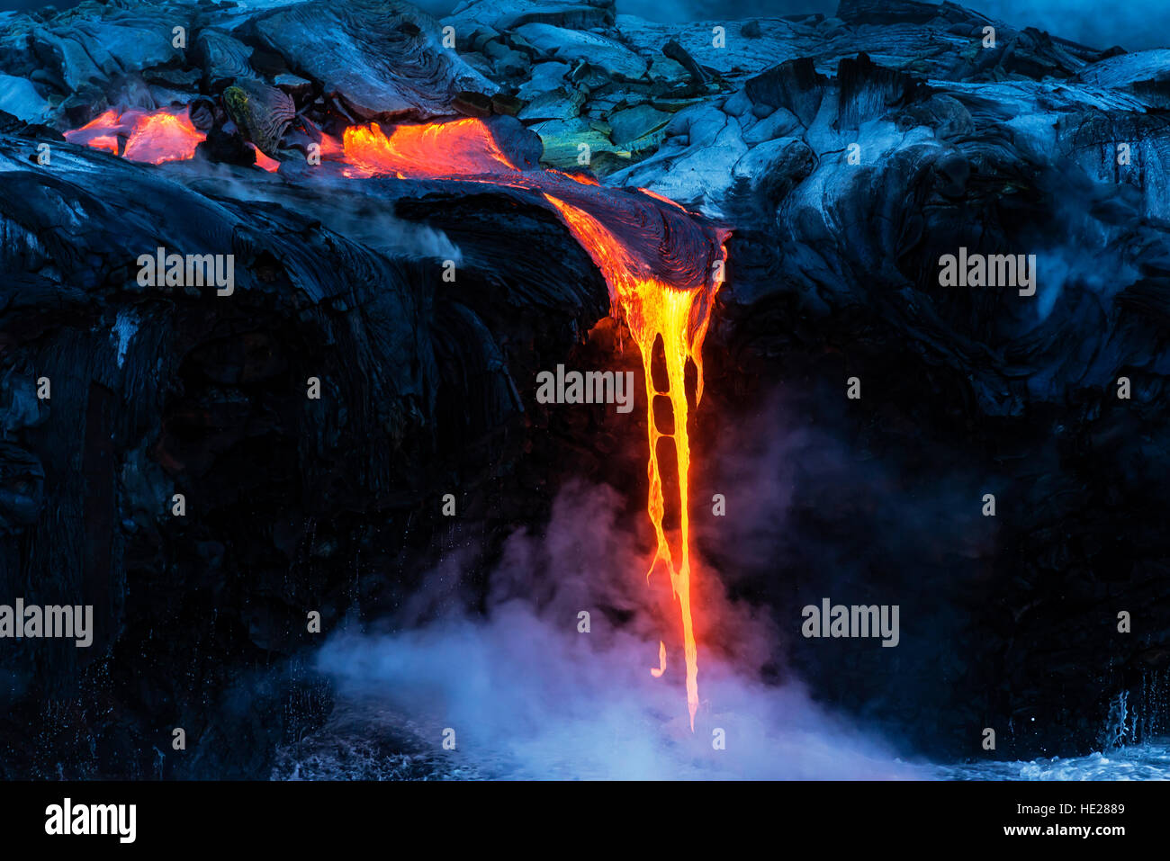 Lava flow entering the ocean at dawn, Hawaii Volcanoes National Park ...