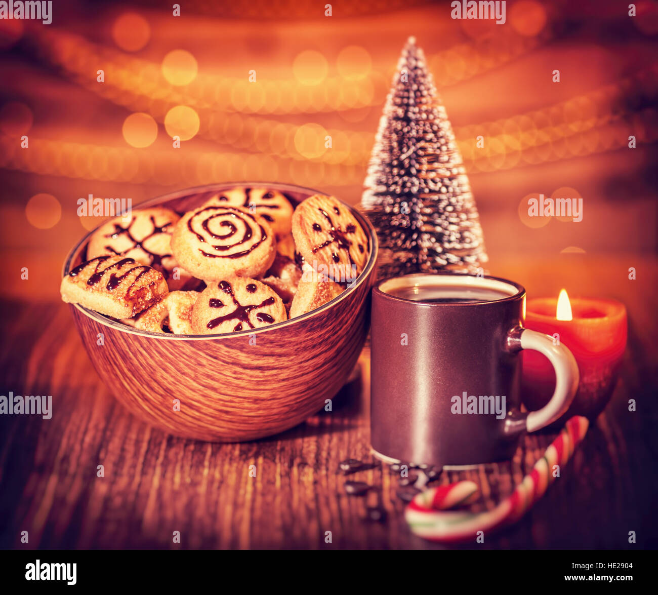 Christmas ginger cookies with coffee cup on the wooden table, candle ...