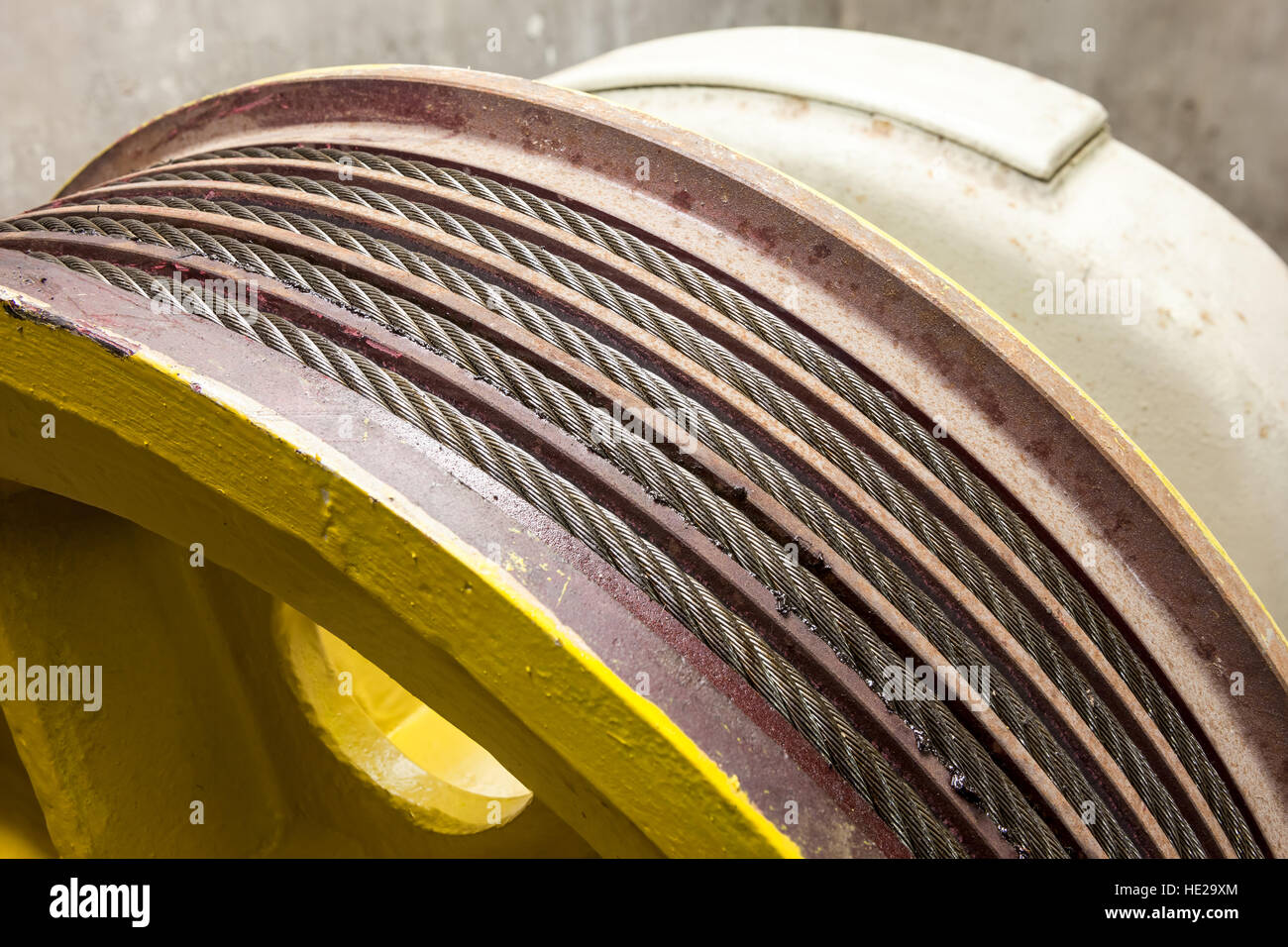 iron cables on a wheel of a motor of the elevator Stock Photo - Alamy