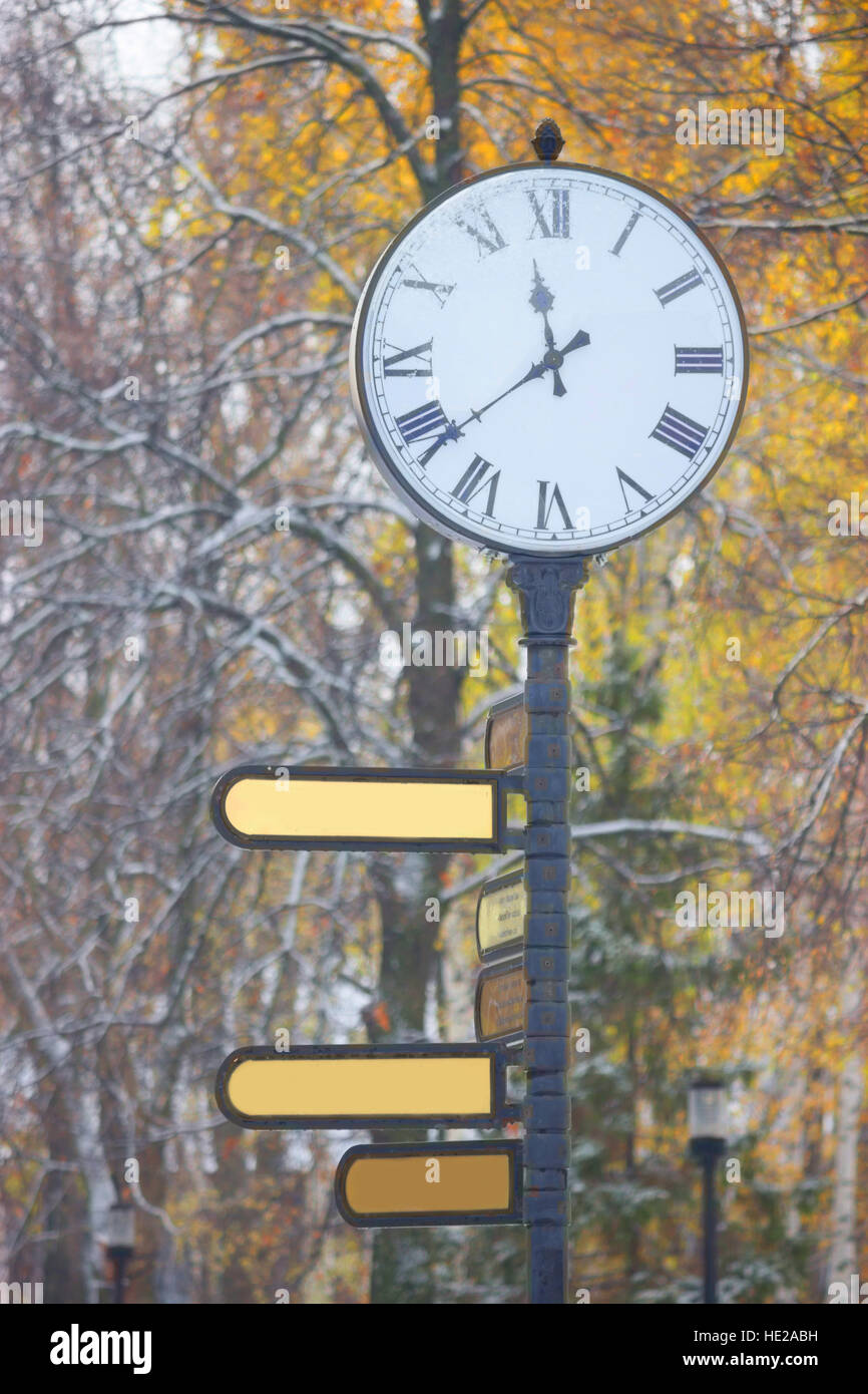 old clock with an guide arrows, autumn Stock Photo - Alamy