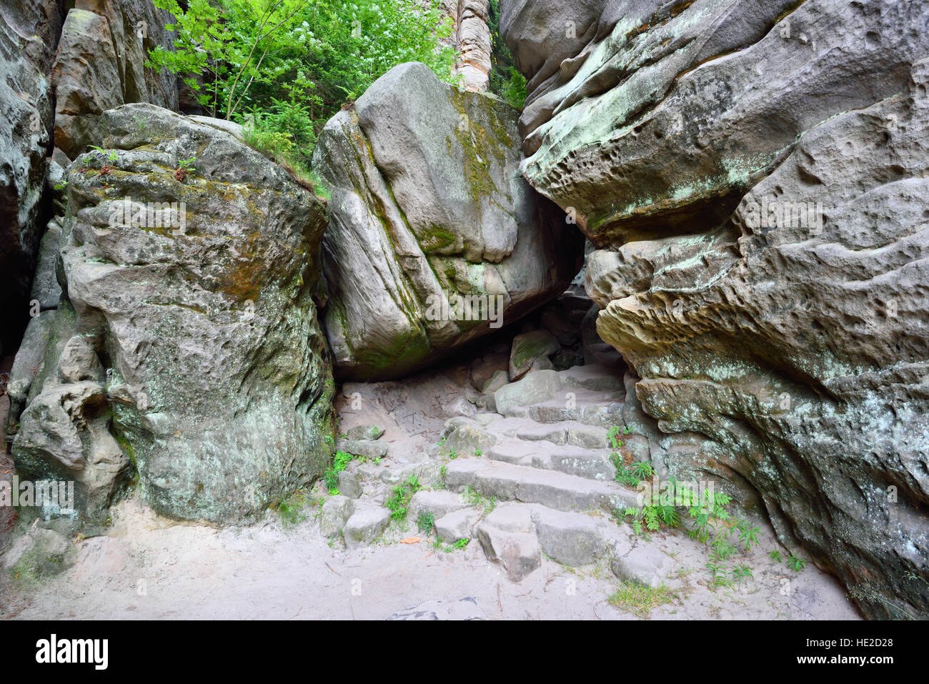 Large boulder fallen on the path in the stone town Stock Photo - Alamy