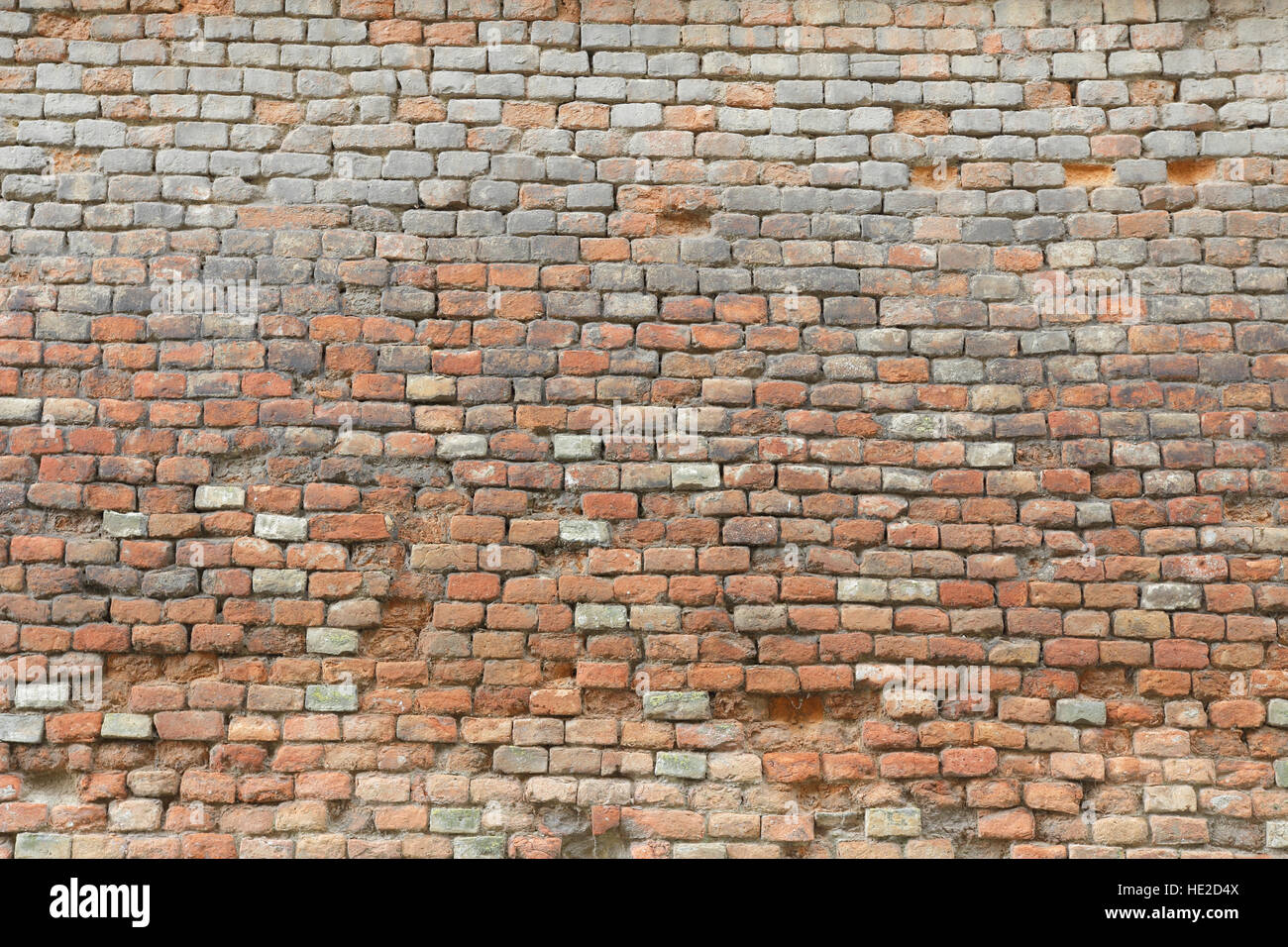 Weathered and damaged brick wall texture background Stock Photo - Alamy