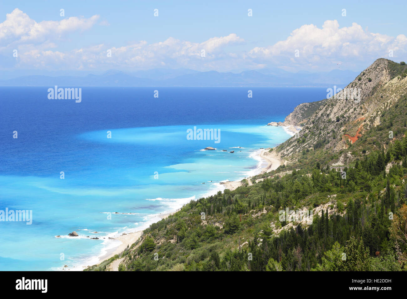 Beautiful turquoise sea and coastal hills with trees on the island of ...