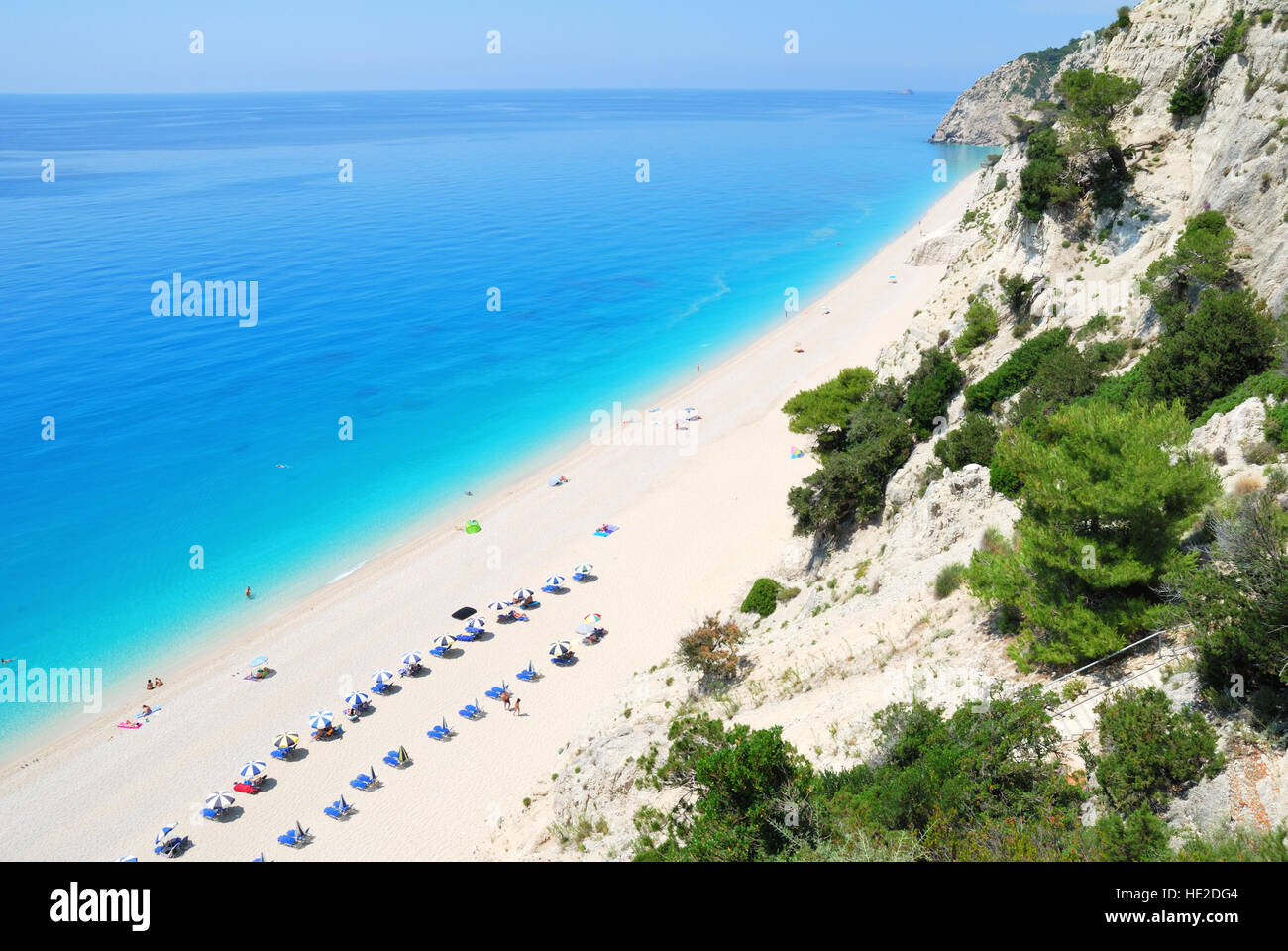 Steep cliffs and large and long beach with turquoise sea Stock Photo ...