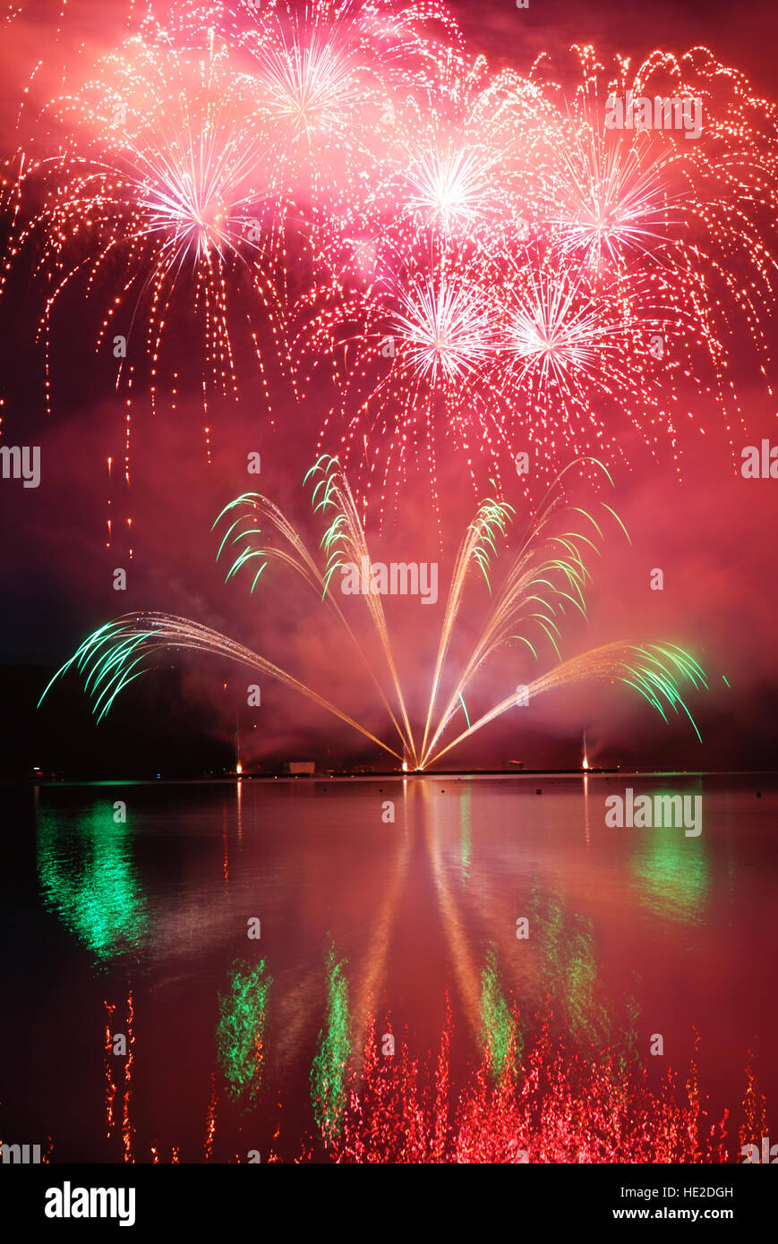 Colorful spectacular fireworks with reflections in the water Stock ...