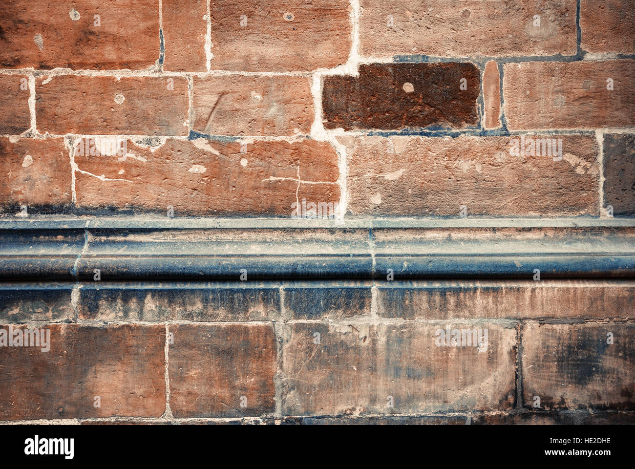 Old weathered red stone wall texture background Stock Photo - Alamy