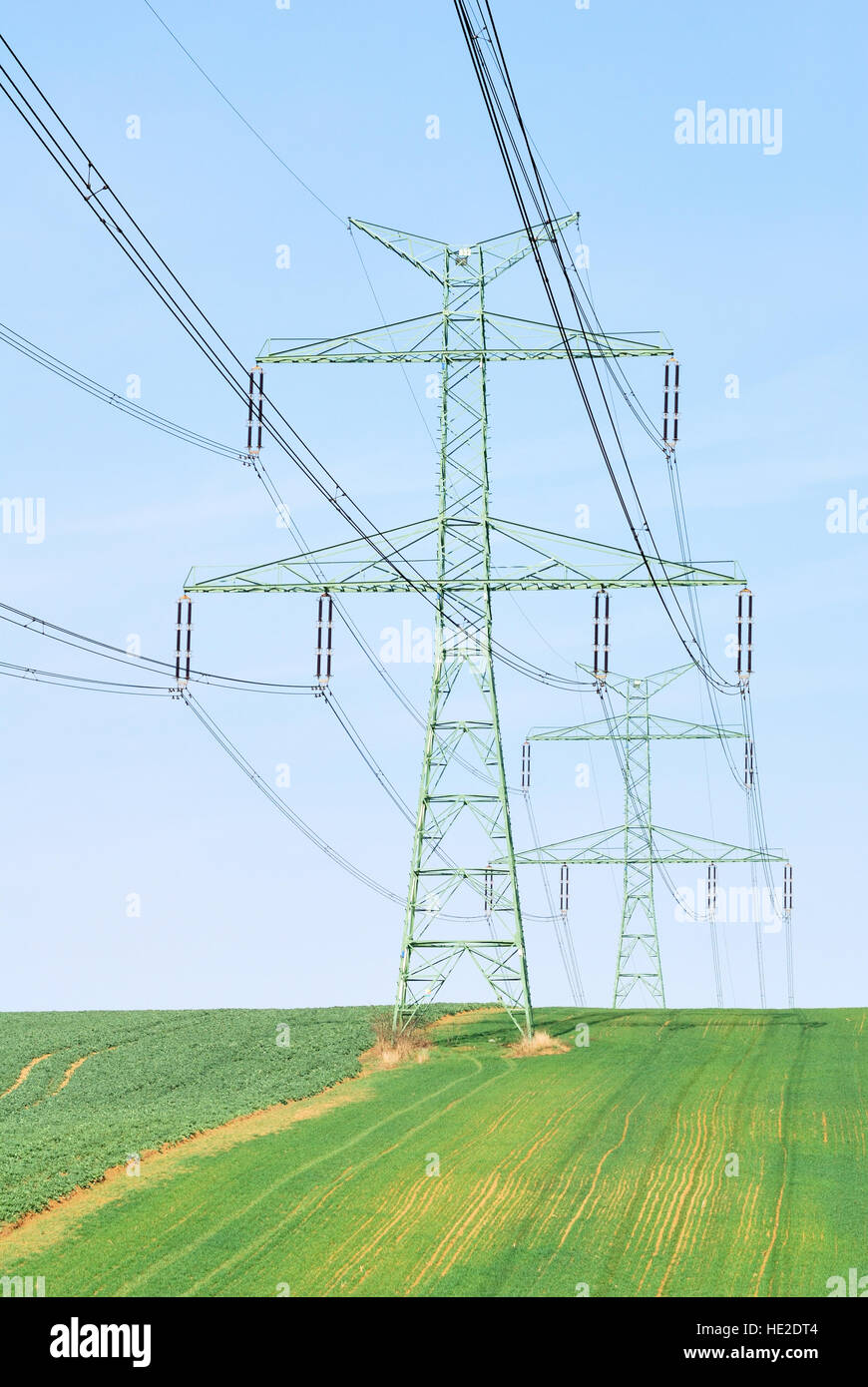 High voltage power lines and countryside fields Stock Photo - Alamy
