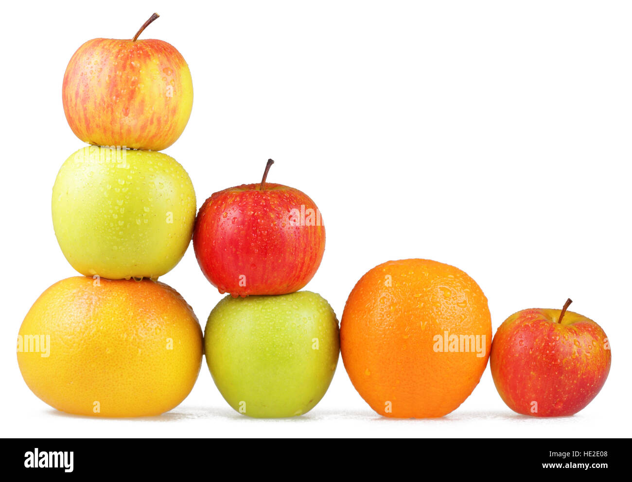 Colorful fruits layered on top of each other on a white background ...