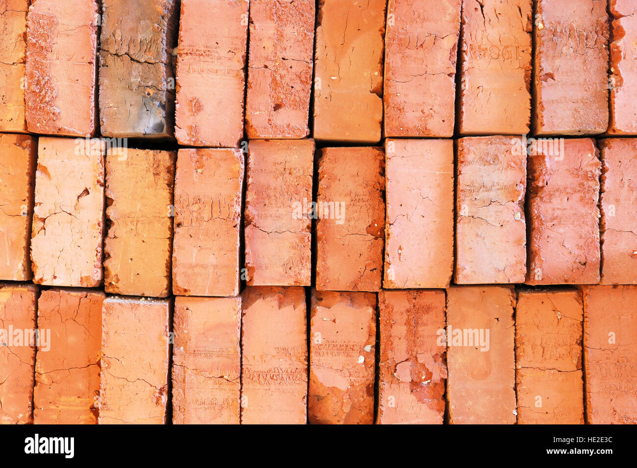 Orange old bricks layered on top of each other Stock Photo - Alamy