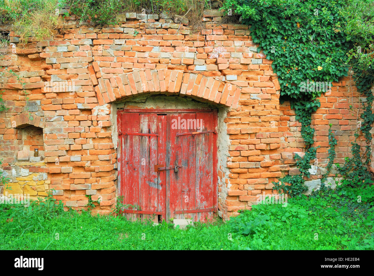Red wooden door to an old wine cellar Stock Photo - Alamy