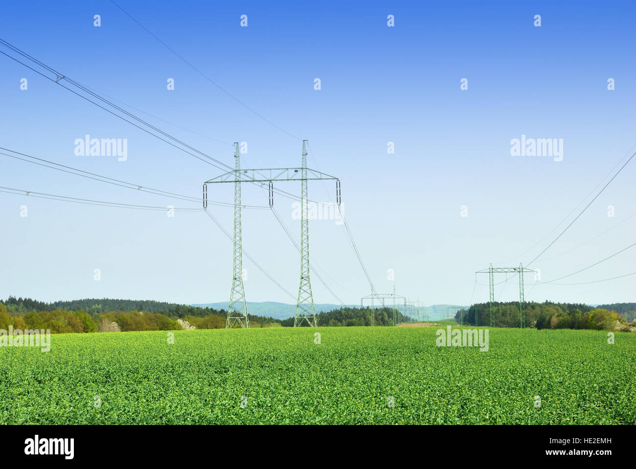 High voltage power lines and countryside Stock Photo - Alamy