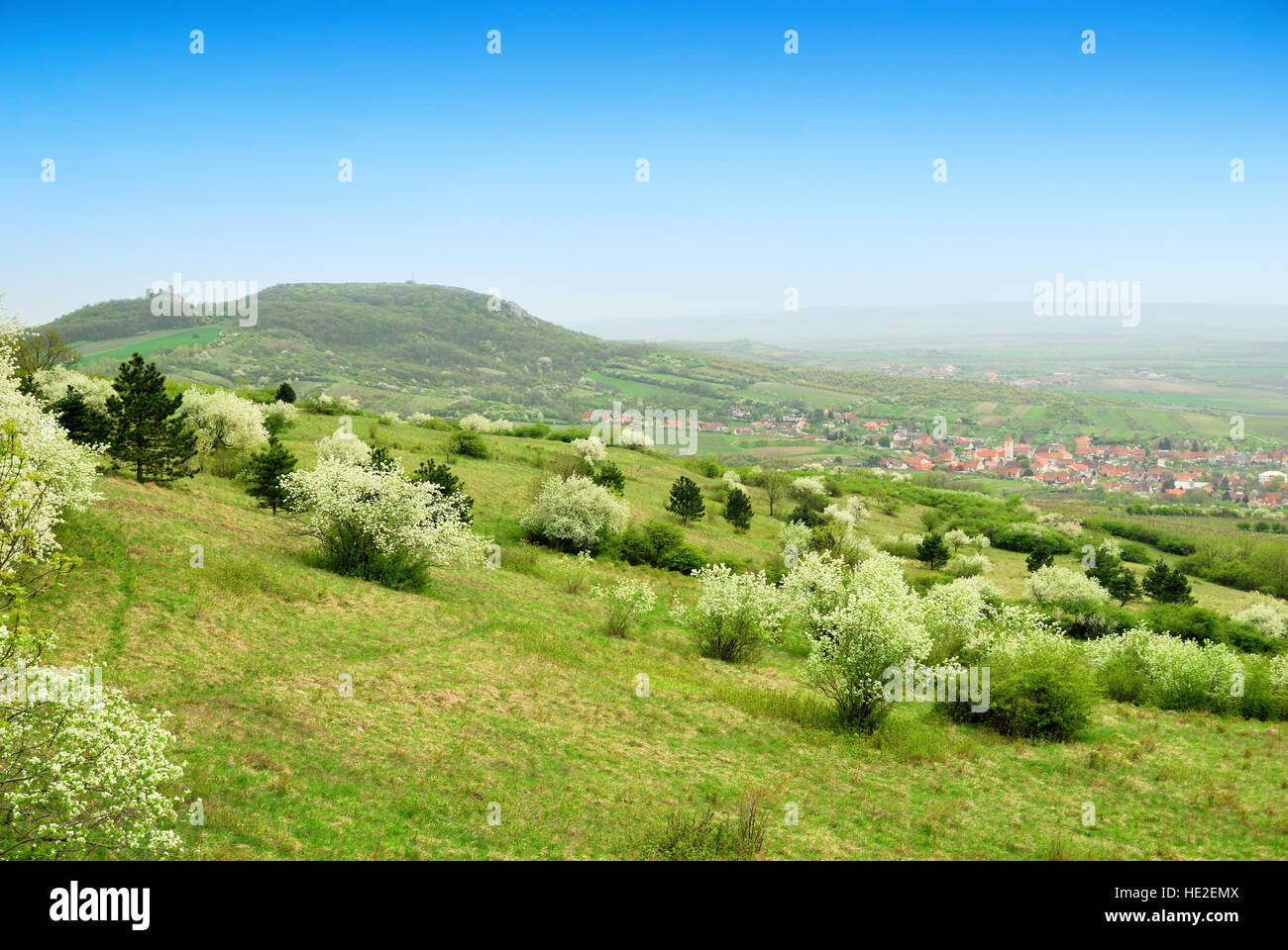 Small hamlet and old castle in springtime Stock Photo - Alamy