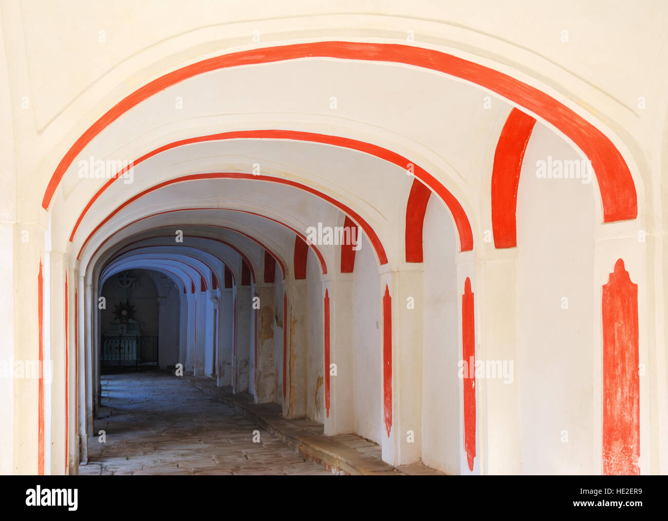 Long chateau archway with red painted arcs Stock Photo - Alamy