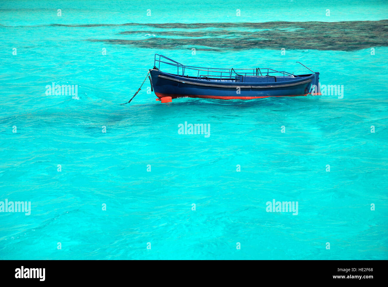 Small Boat and Azure Sea Stock Photo - Alamy