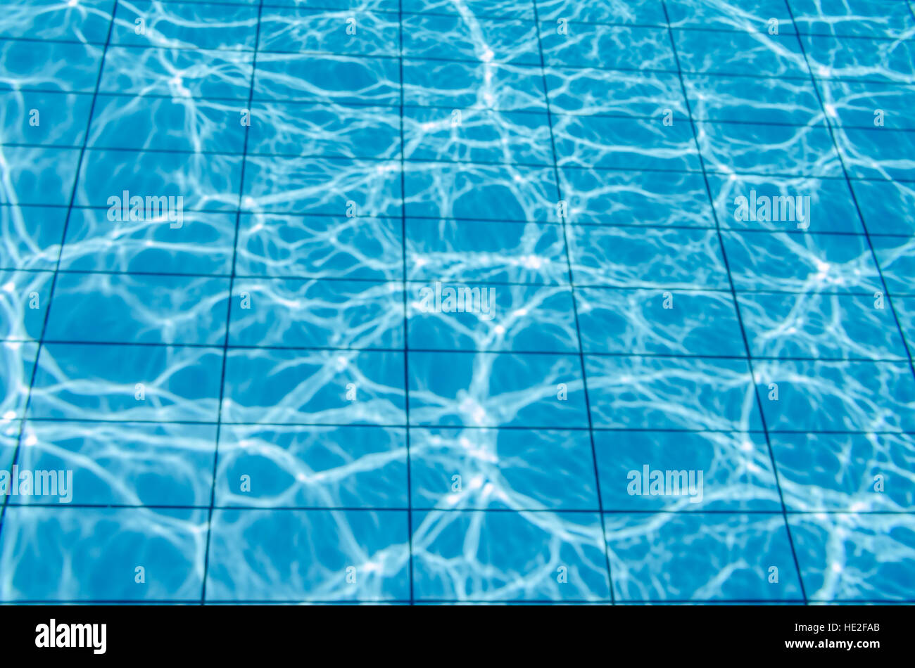 Abstract background with sun splash in pool Stock Photo - Alamy