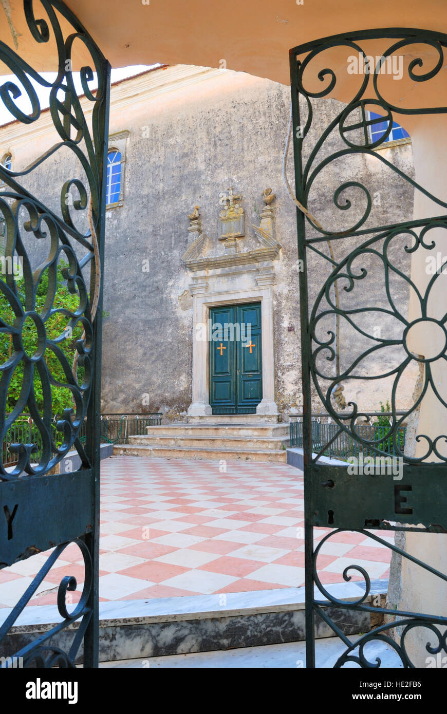 Greek monastery and opened iron ornamental gate Stock Photo - Alamy