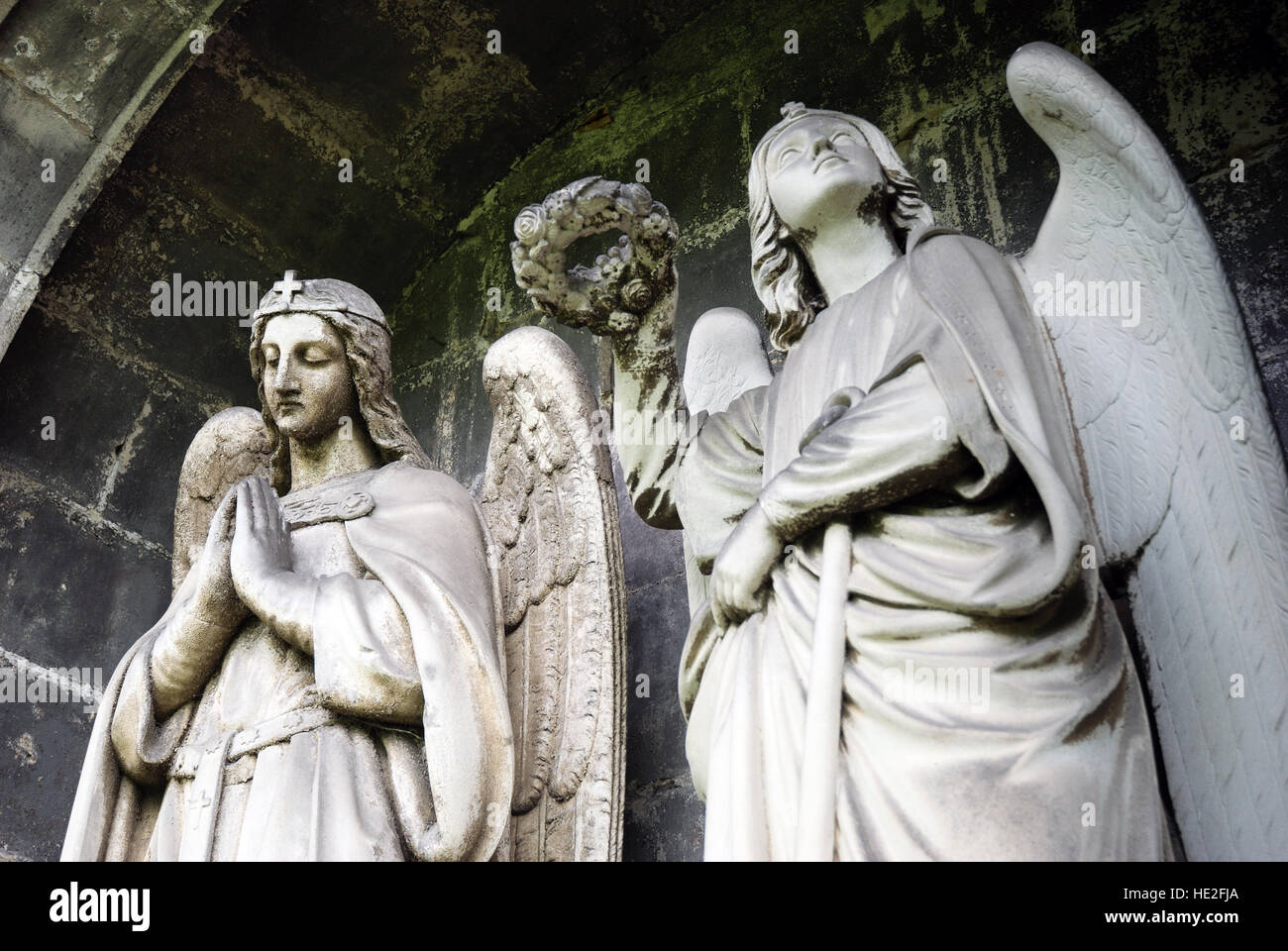 Stone statues of two angels Stock Photo - Alamy