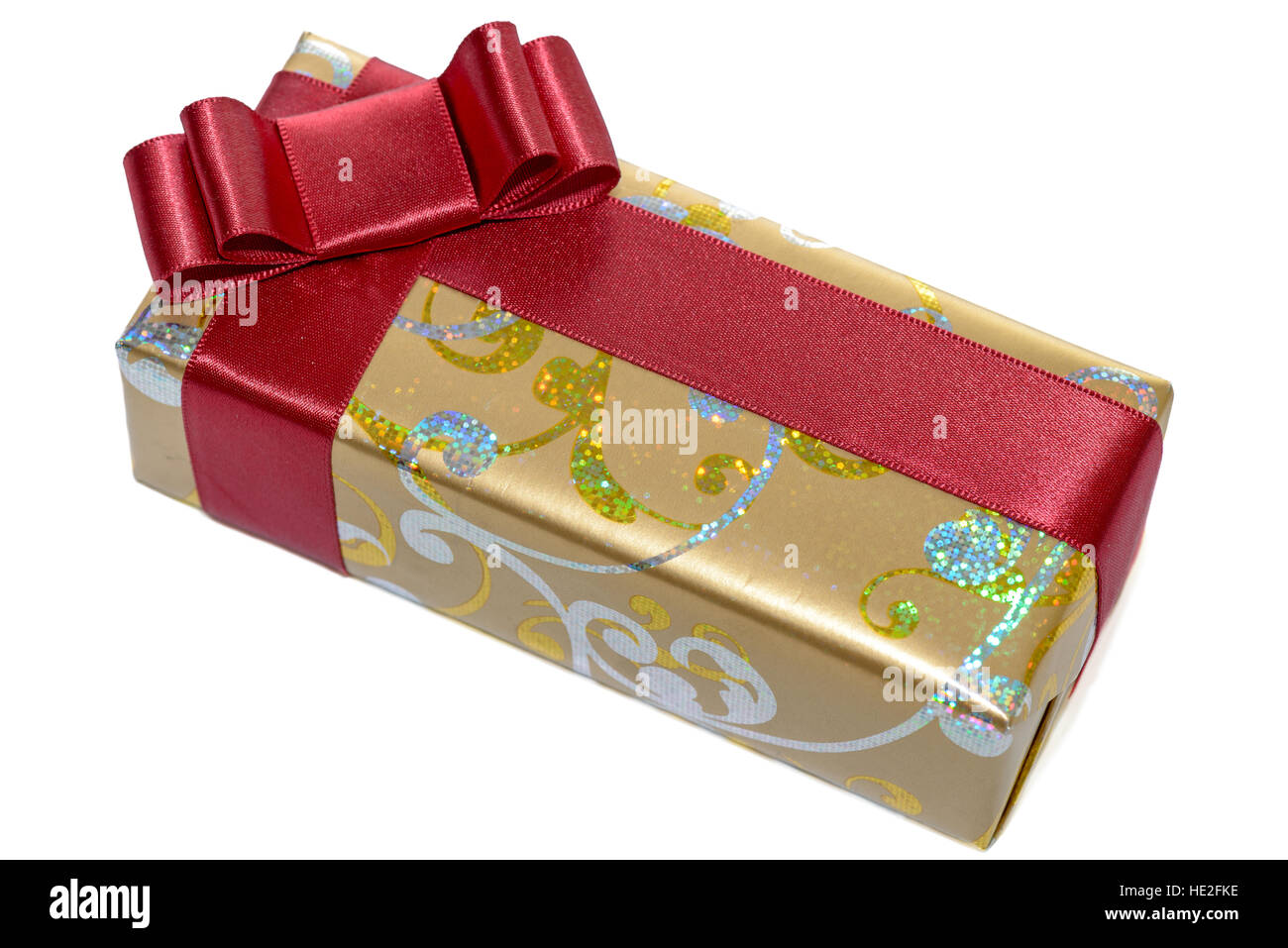 Wrapped gift with red ribbon and bow isolated on white background Stock ...
