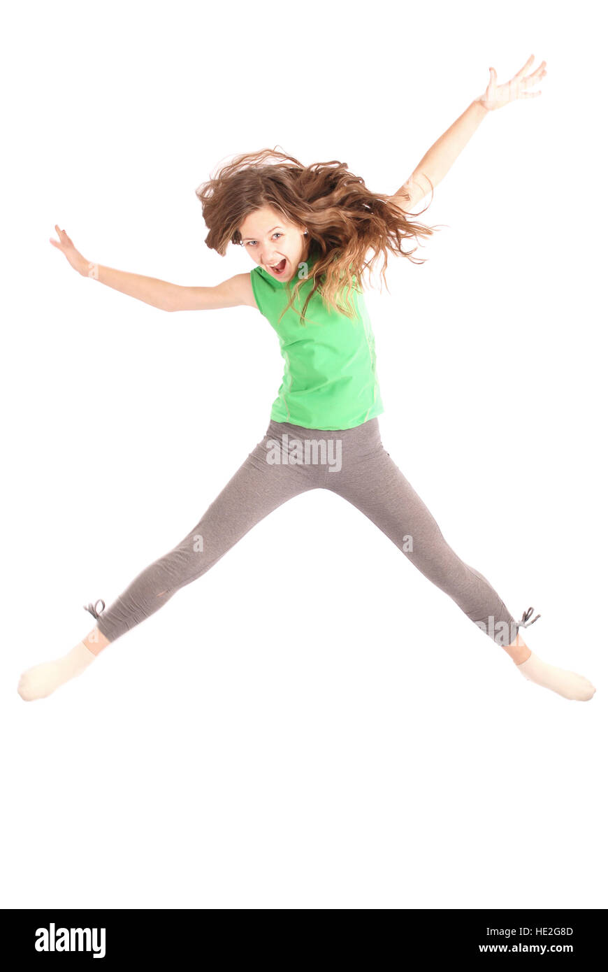 Girl jumping isolated on white studio background Stock Photo - Alamy